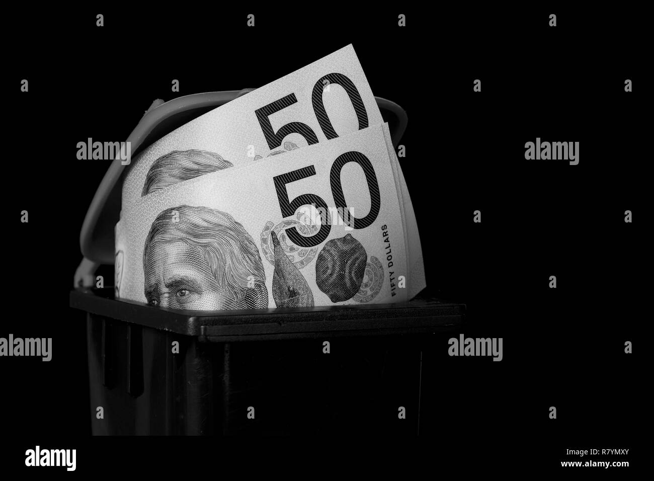 Australian fifty dollar notes in a trash bin in black and white Stock ...
