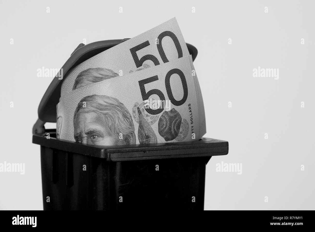 Australian fifty dollar notes in a trash bin in black and white Stock ...