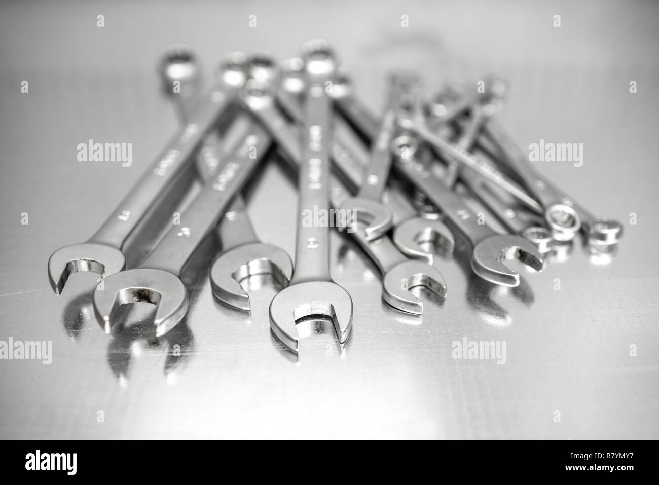 Pile of a new car wrenches on the stainless table Stock Photo - Alamy