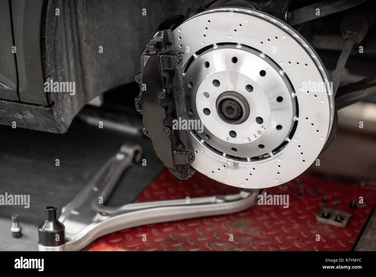 Disk of a luxury sports car at the car service Stock Photo - Alamy