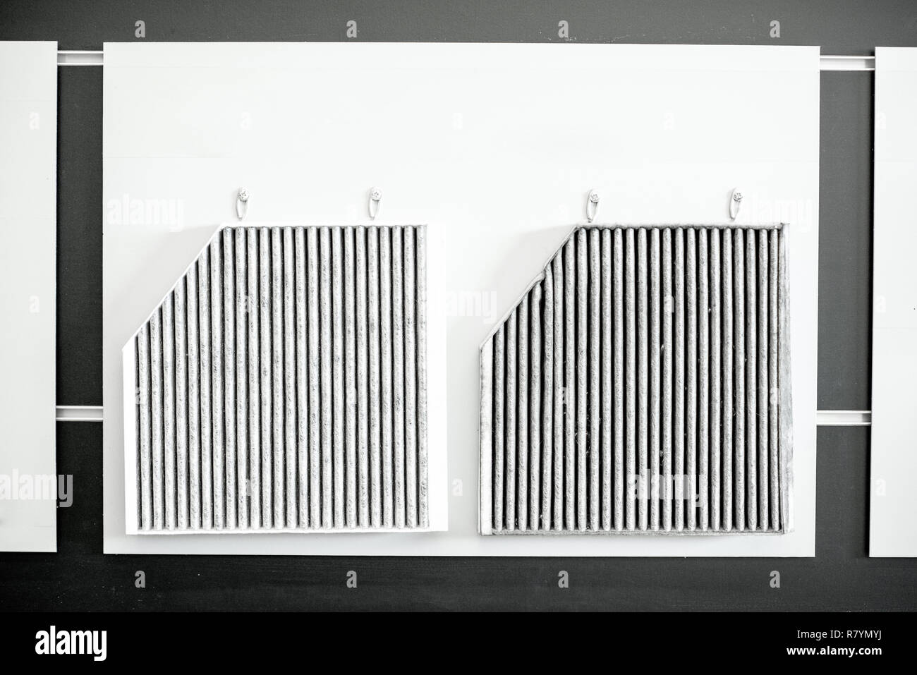 Board with new and used cabin air filter at the car service Stock Photo ...