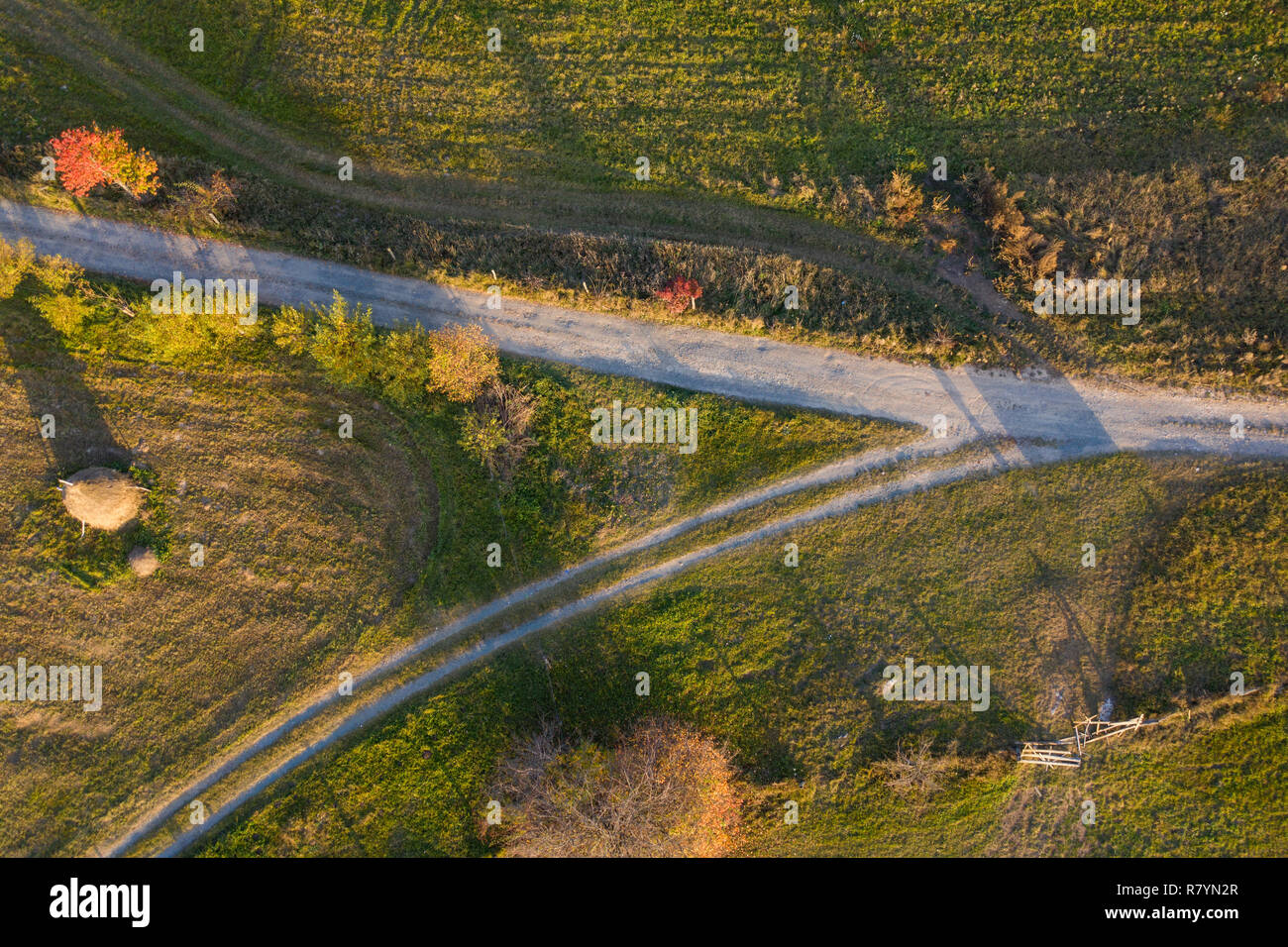 Aerial picture of a countryside village road. Drone shot of ...