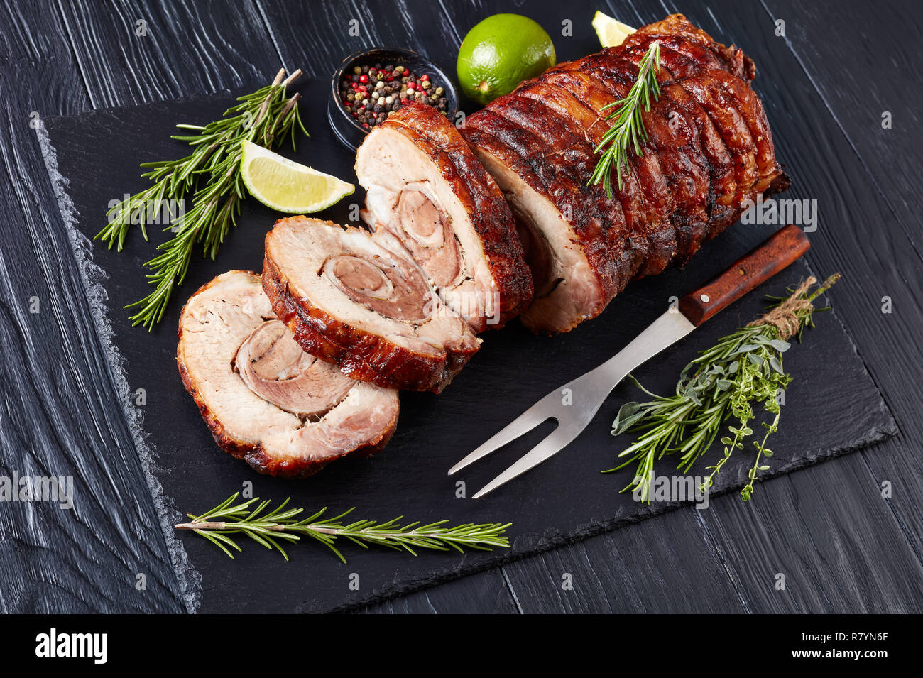 overhead view of sliced roast pork roulade - Porchetta, delicious pork ...