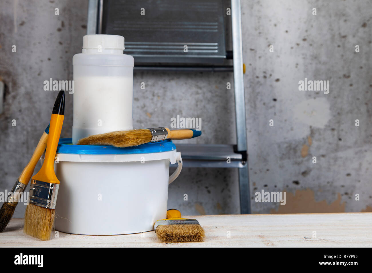 Paint can,roller and brush on the table. Items for home or office ...