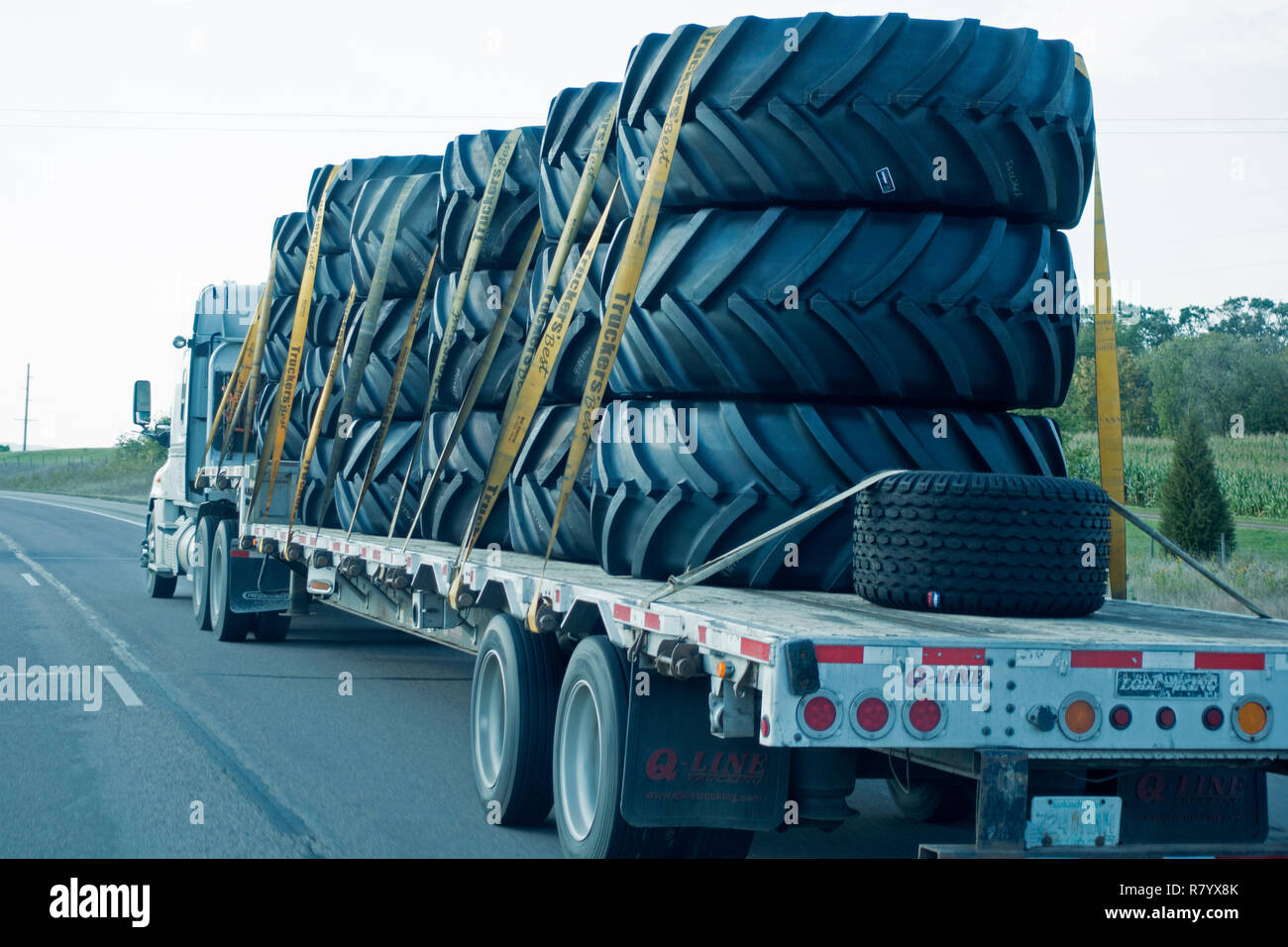 Truck hauling tires for large machines on Freeway 94 Minnesota MN USA ...