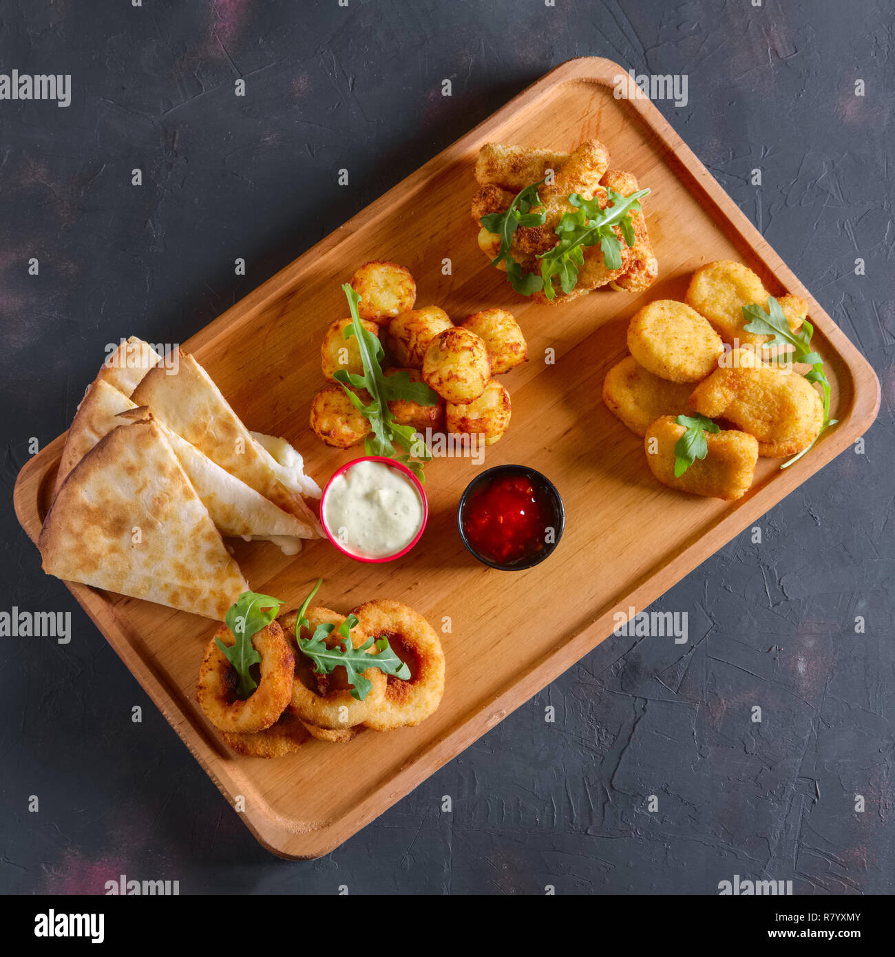 Wooden plate with snack for beer Stock Photo - Alamy