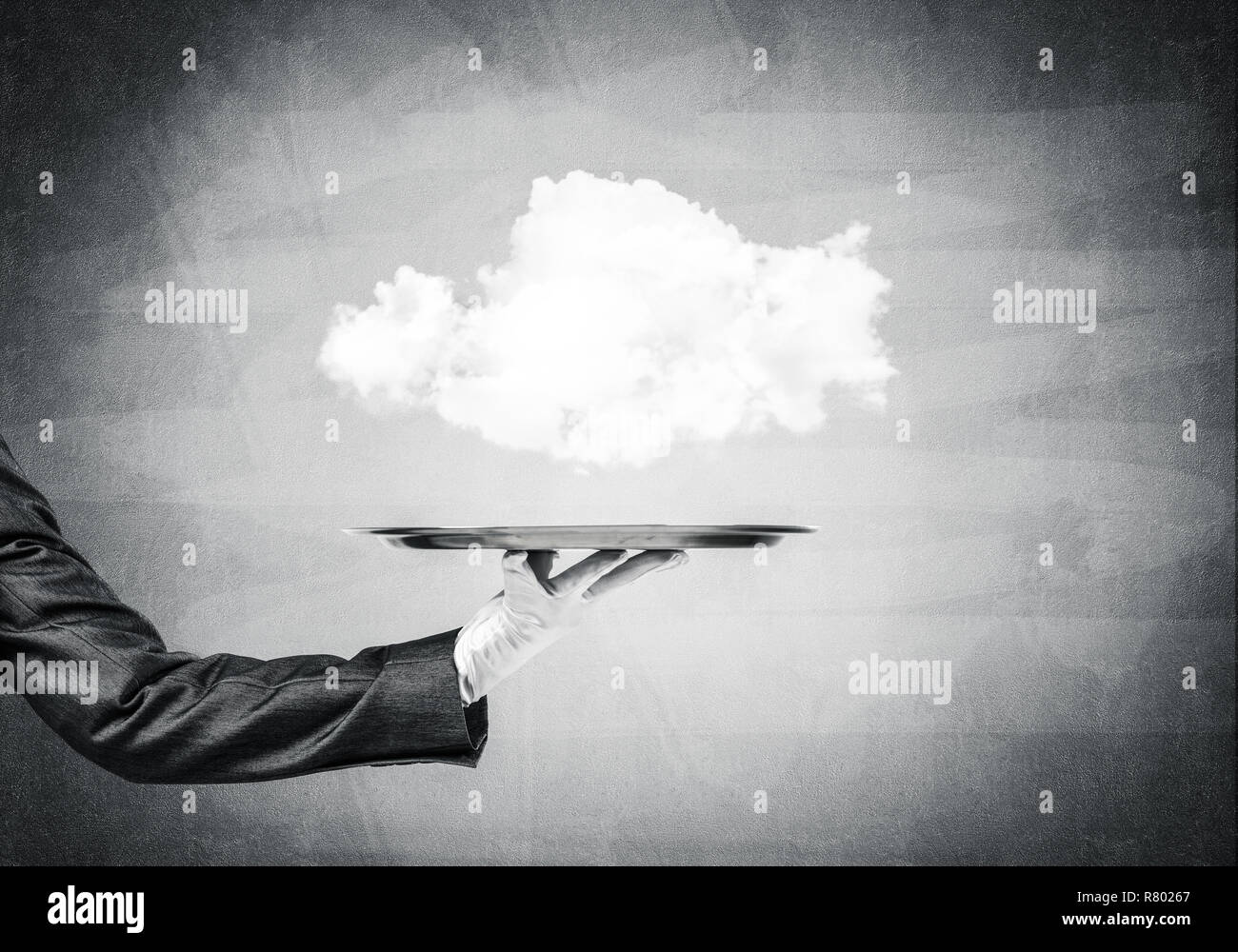 Hand of waitress presenting cloud on tray Stock Photo - Alamy