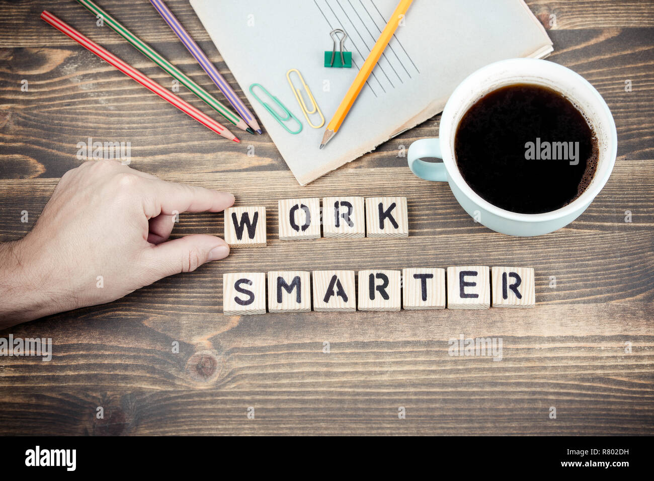 Work Smarter. Wooden letters on the office desk Stock Photo - Alamy