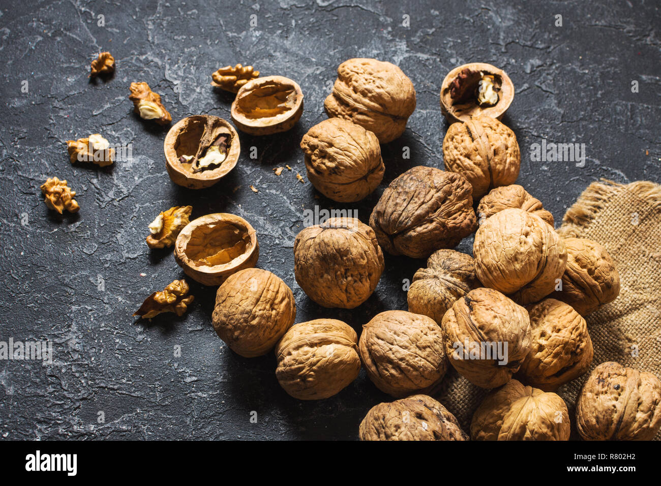 Walnut kernels on a dark stone background Stock Photo - Alamy