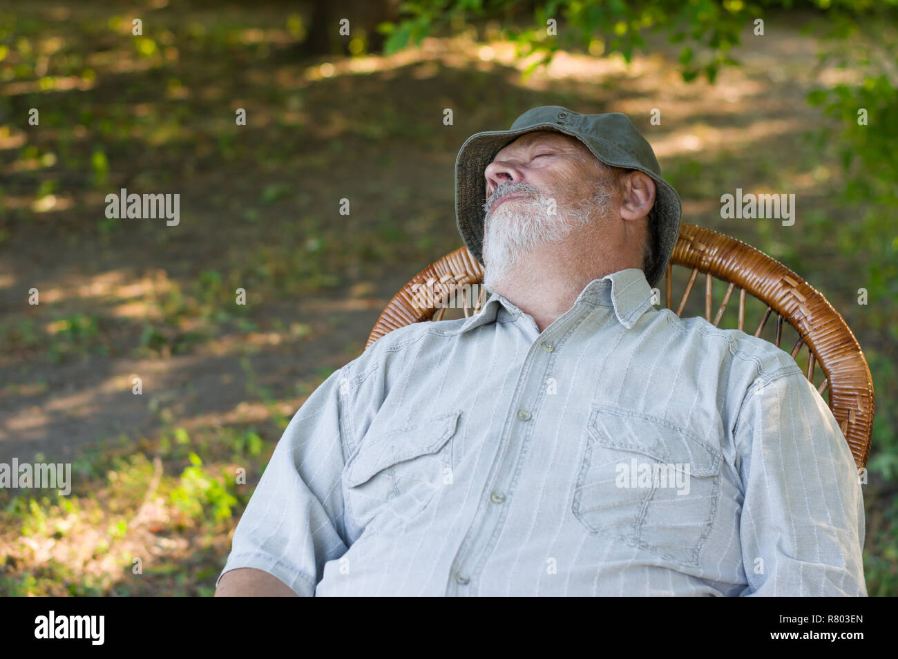 Man sleeping in chair hi-res stock photography and images - Alamy