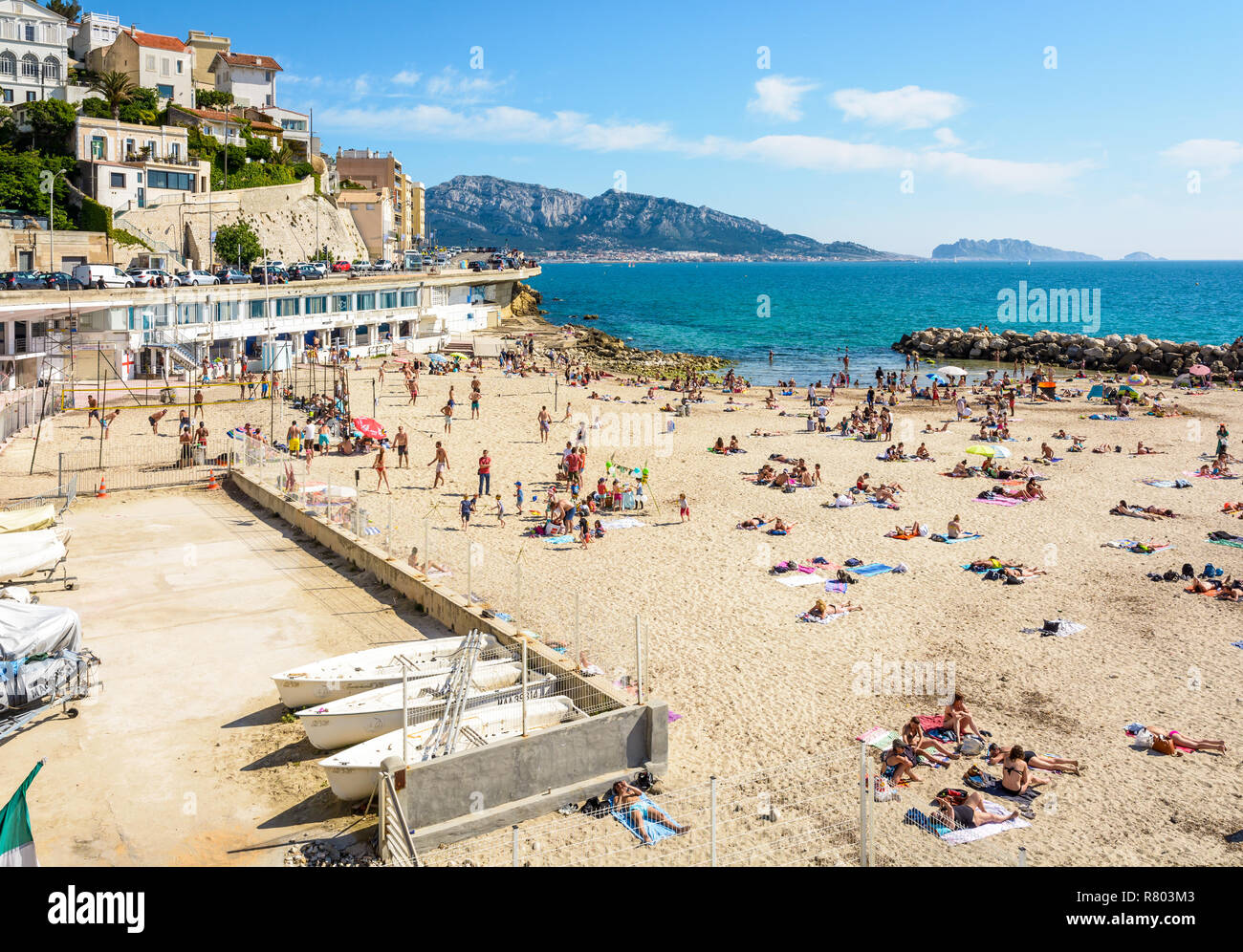 People sunbathing and swimming on the Prophet beach in Marseille, a ...