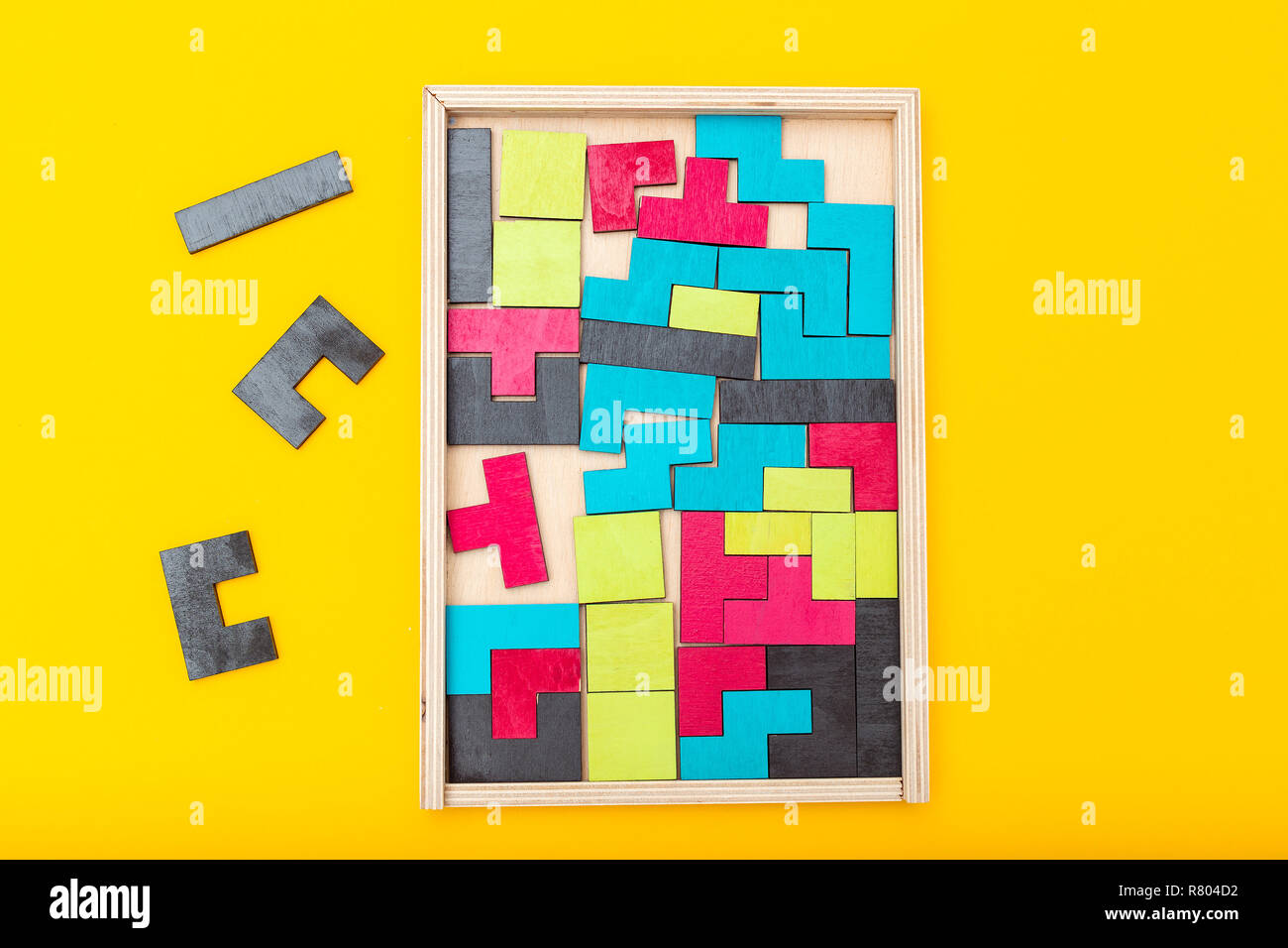Tangram game wooden and colorful on yellow background. Flat lay Stock ...