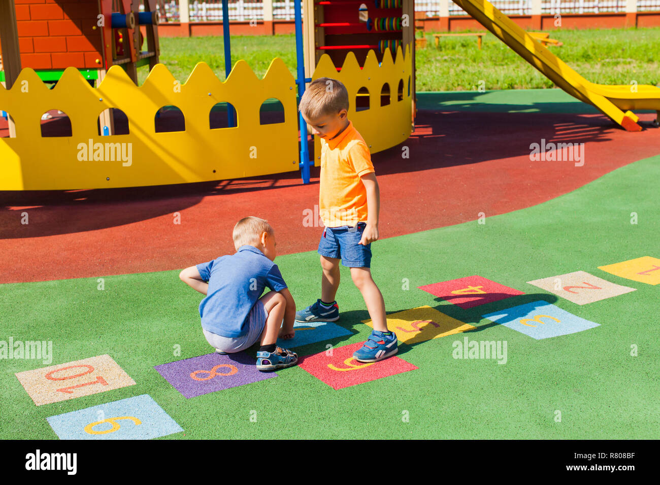 Kids playing hopscotch hi-res stock photography and images - Alamy