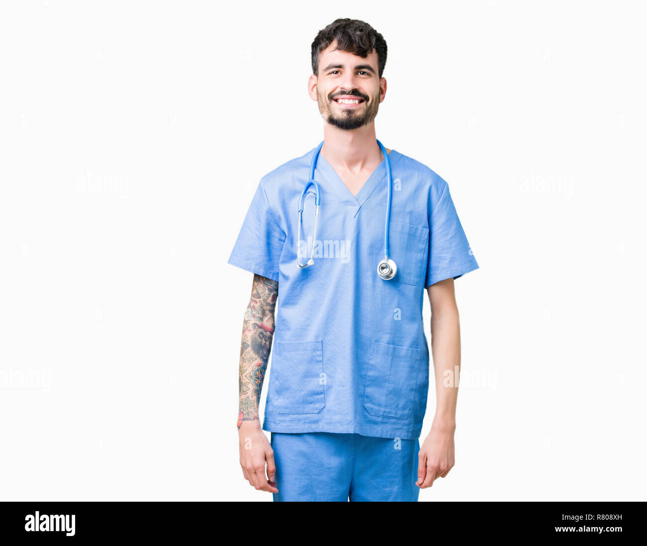 Young handsome nurse man wearing surgeon uniform over isolated ...