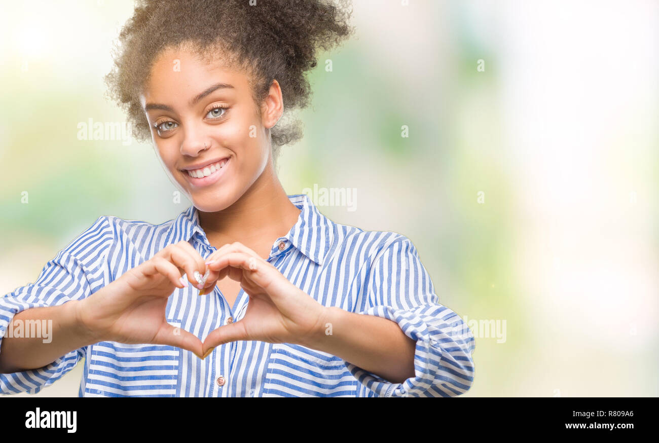 Young afro american woman over isolated background smiling in love ...