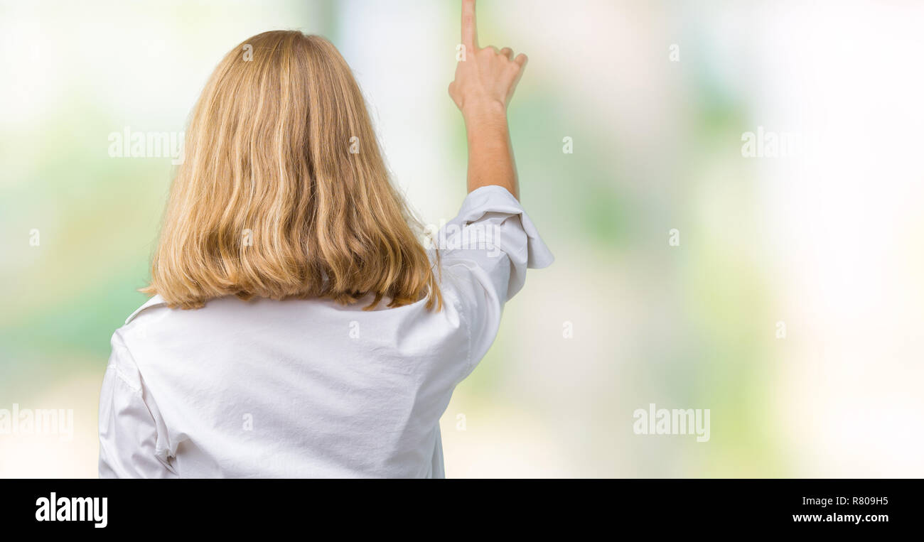 Beautiful young business woman over isolated background Posing ...