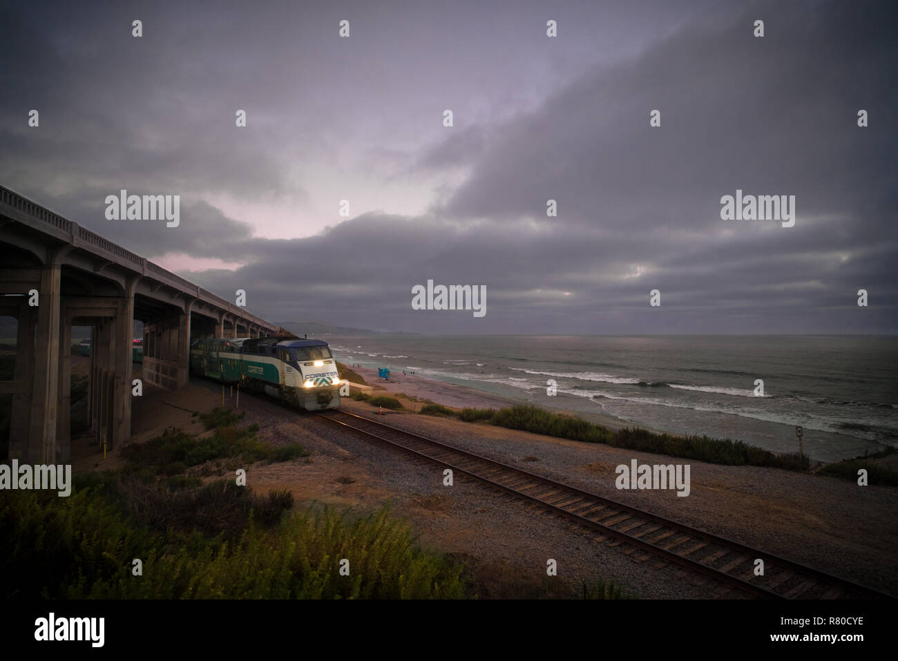 Train underneath bridge in La Jolla at dusk Stock Photo - Alamy