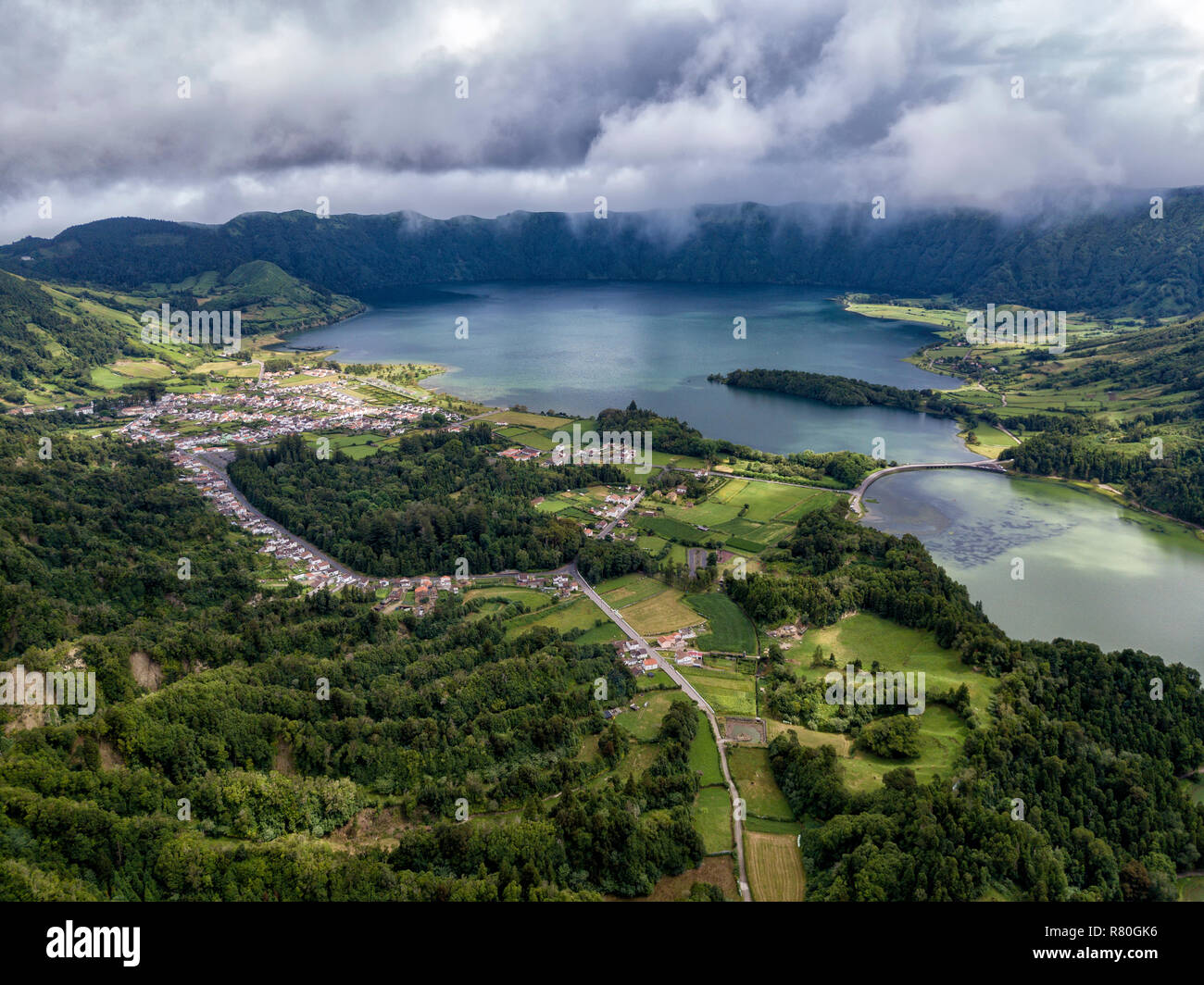 Aerial view of Sete Cidades village and Lagoa Azul and Verde on Sao ...