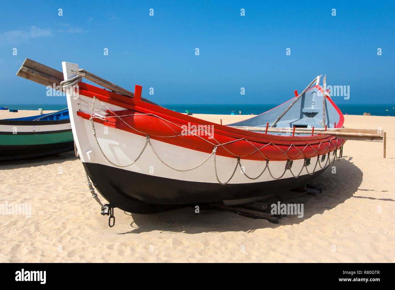 The fishing boat on the beach in Portugal Stock Photo - Alamy