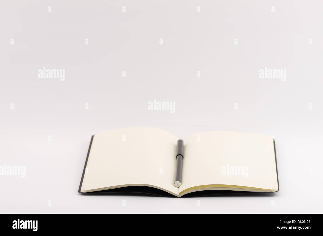 open blank copybook with pencil backdrop - white background Stock Photo ...