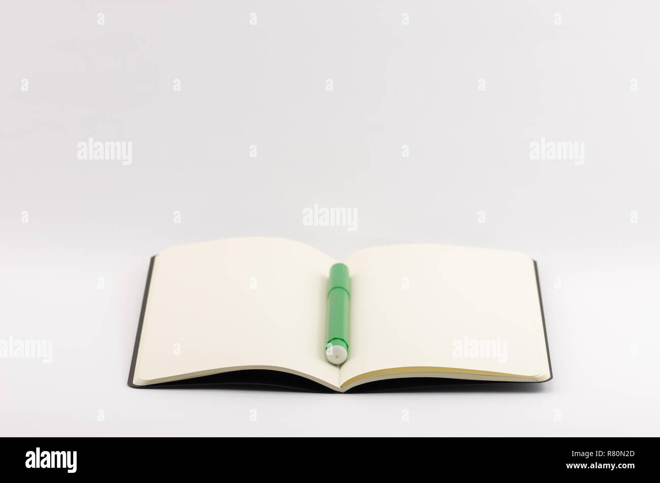 open blank copybook with pencil backdrop - white background Stock Photo ...