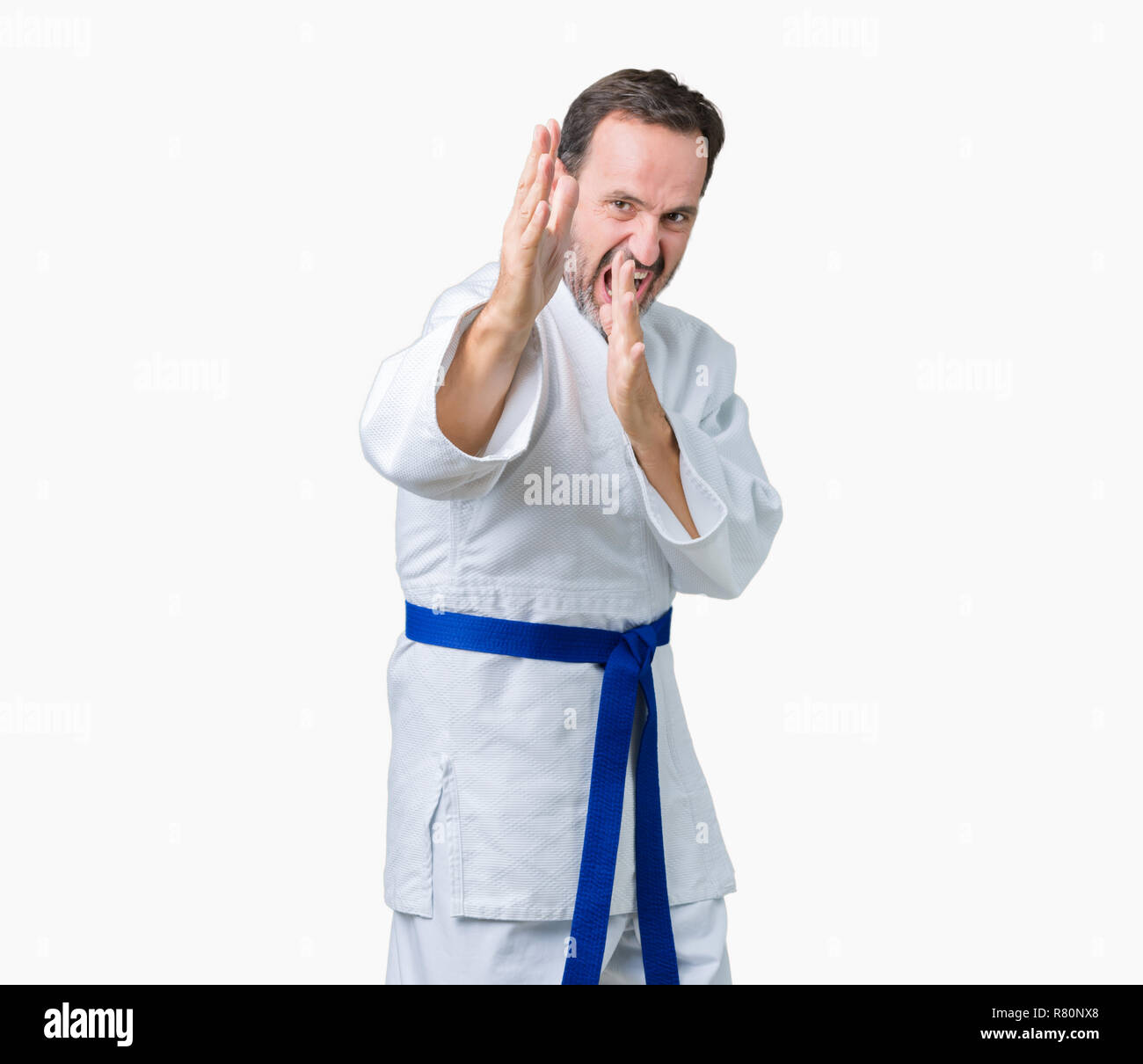 Handsome middle age senior man wearing kimono uniform over isolated ...