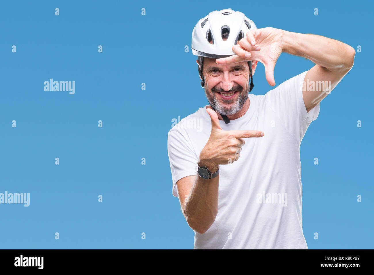 Middle age senior hoary cyclist man wearing bike safety helment ...