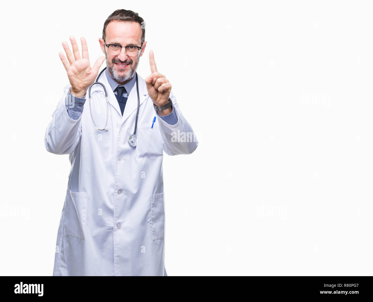 Middle age senior hoary doctor man wearing medical uniform isolated ...