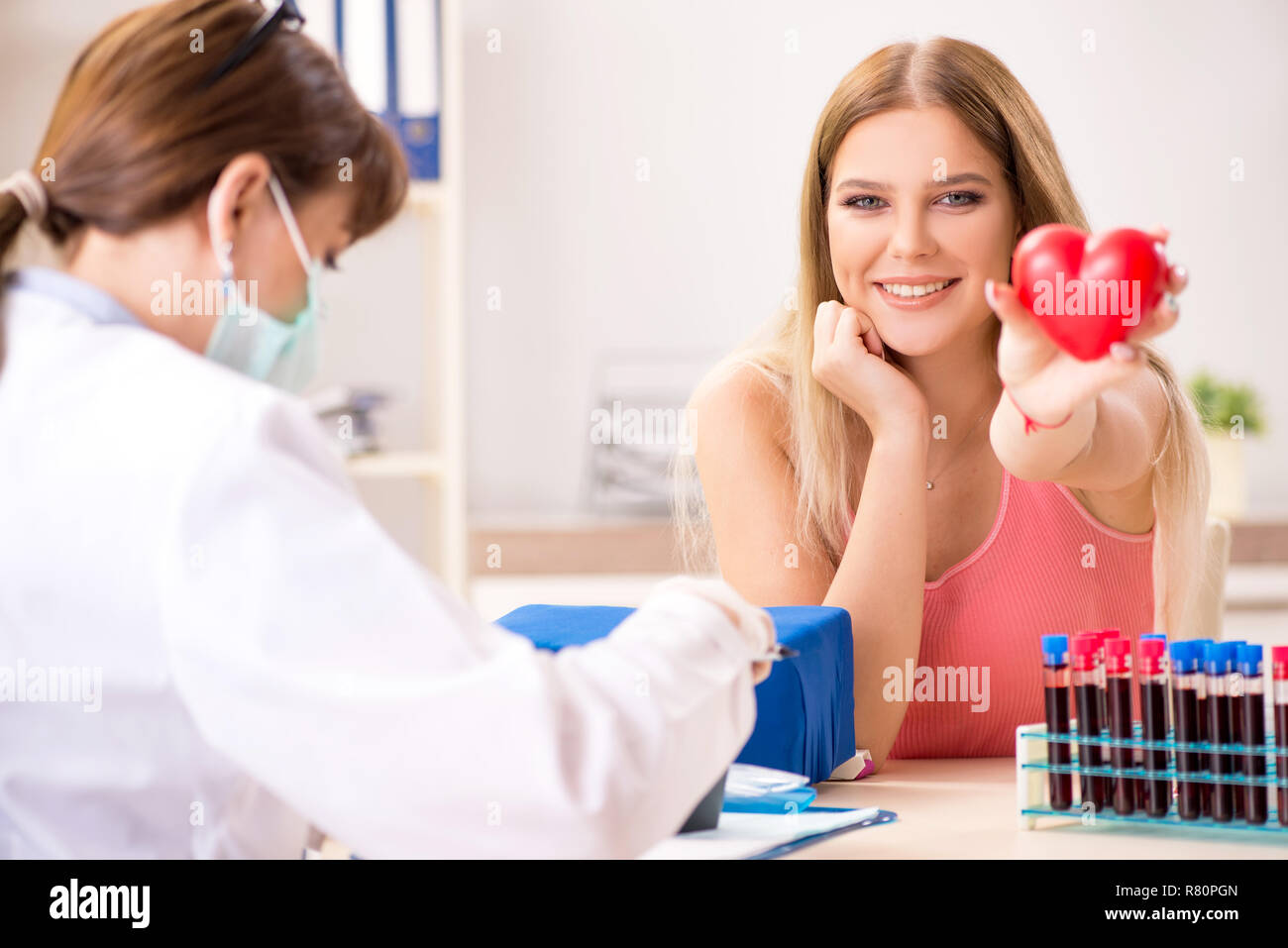 Young beautiful woman during blood test sampling procedure Stock Photo ...