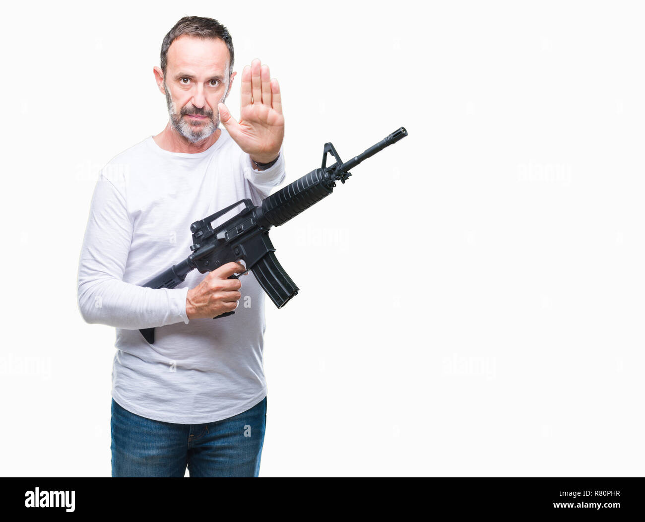 Middle age senior hoary criminal man holding gun weapon over isolated ...