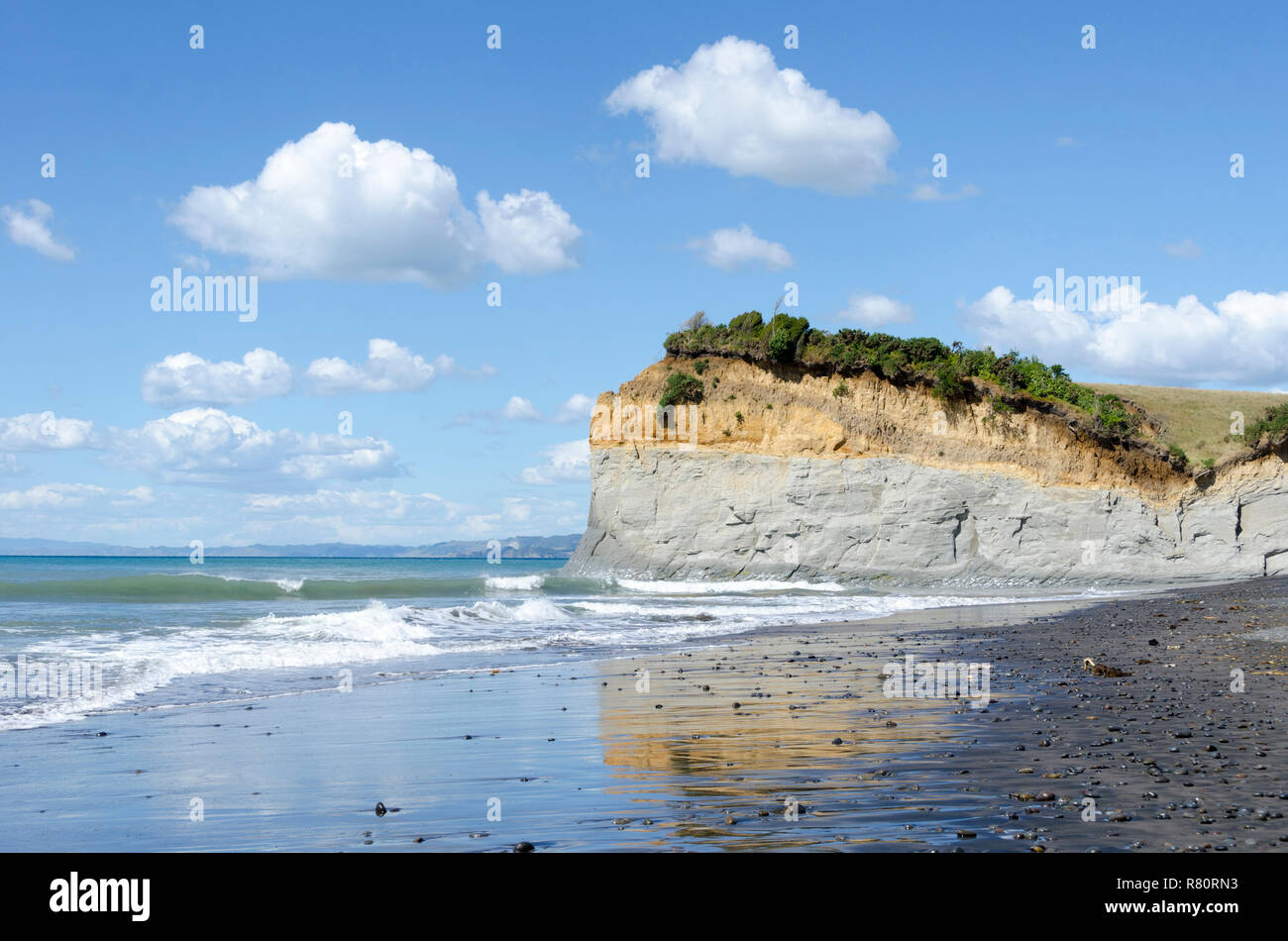 Cliffs reflected in wet beach, Onaero, Taranaki, North Island, New ...