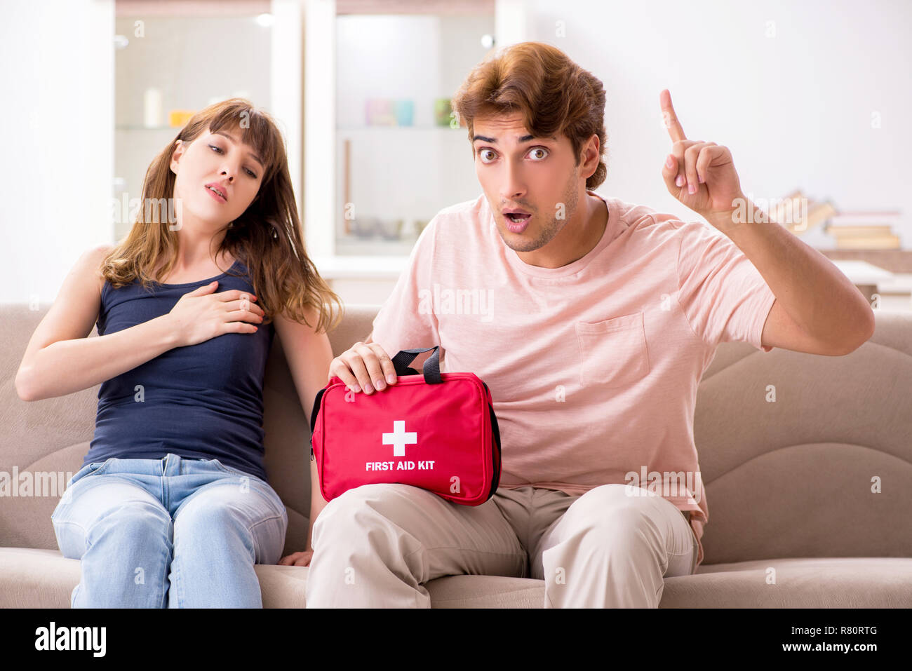 Young family getting treatment with first aid kit Stock Photo - Alamy