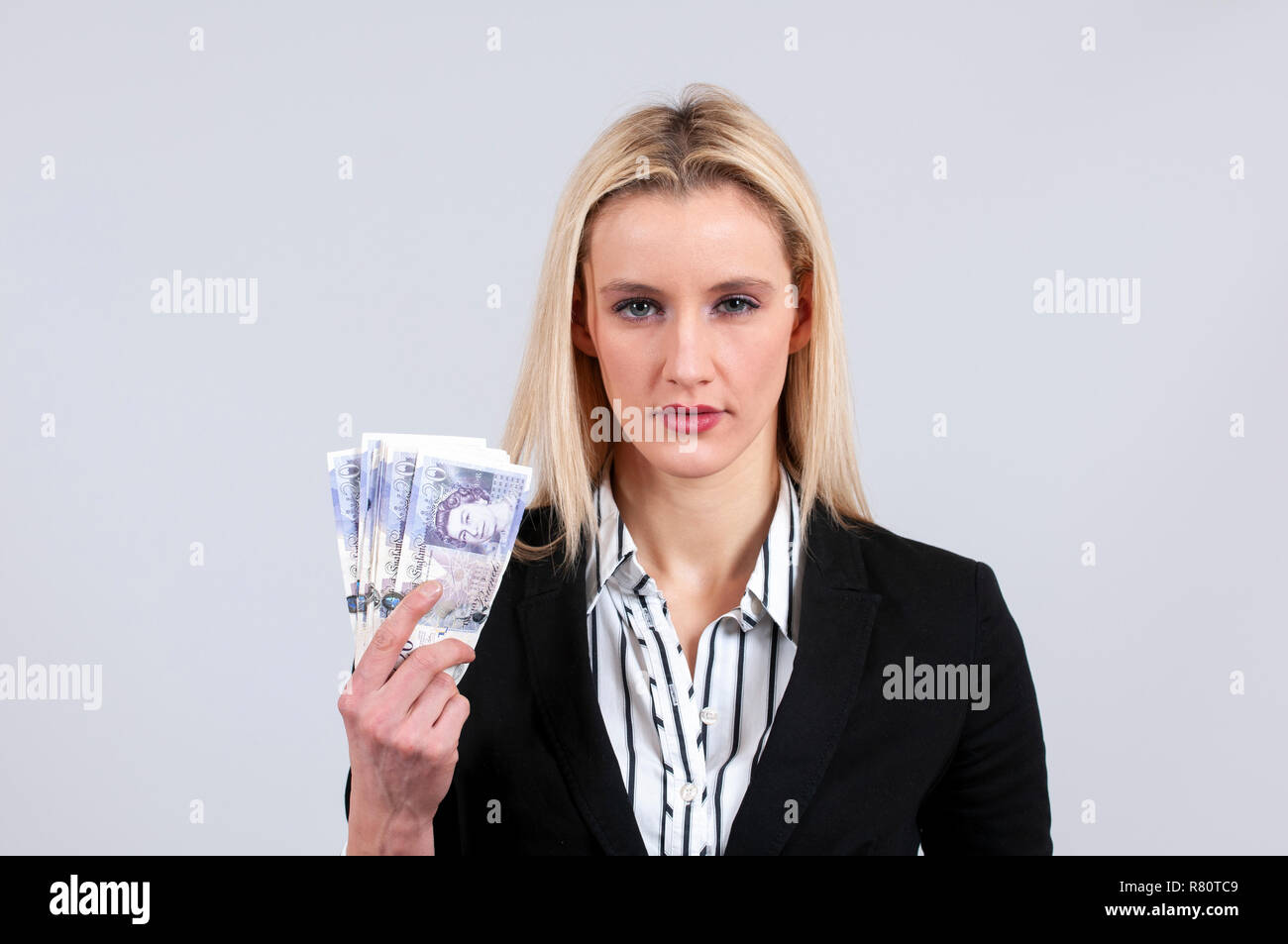 Women holding cash sterling hi-res stock photography and images - Alamy