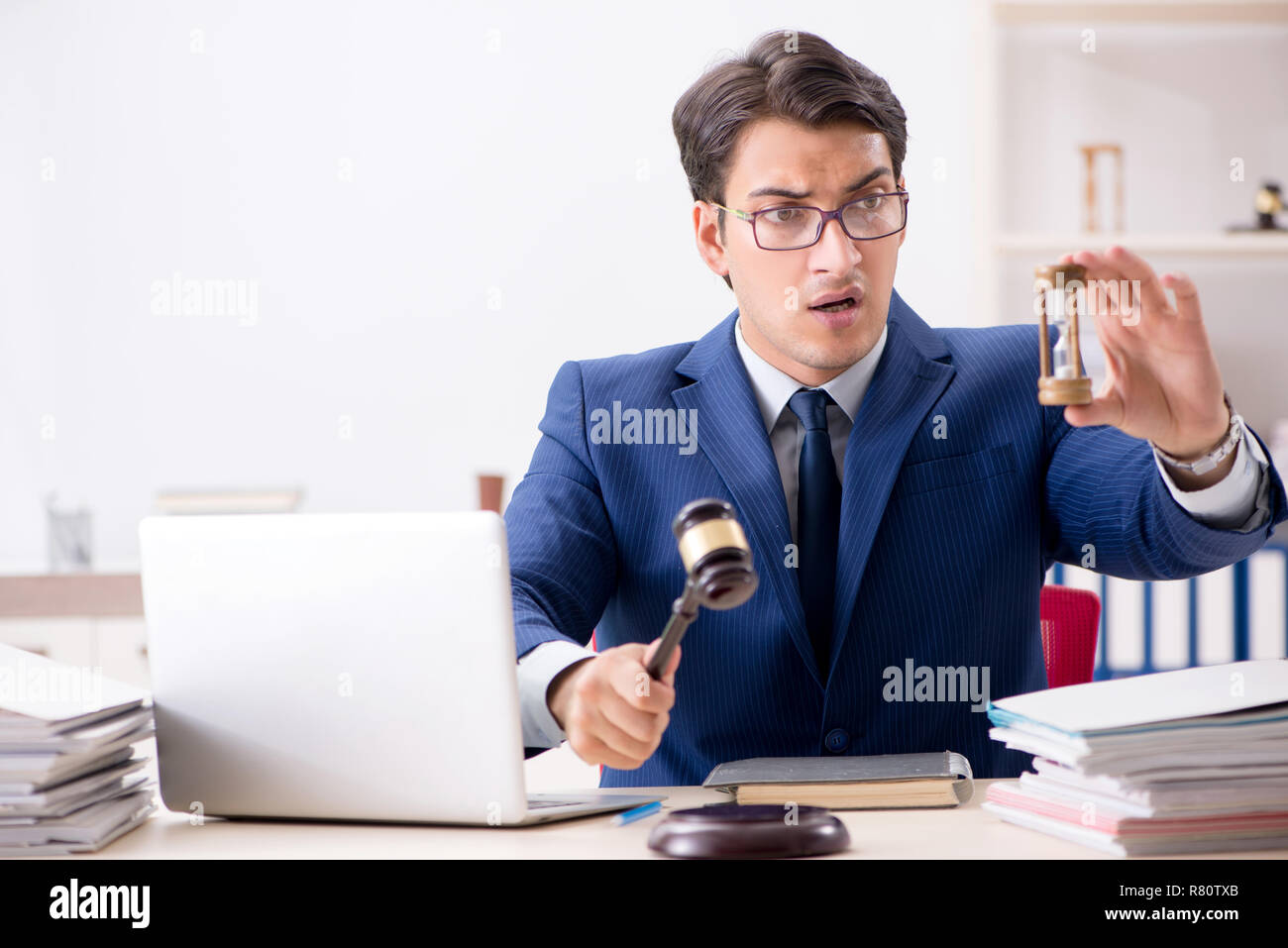 Young handsome judge working in court Stock Photo - Alamy