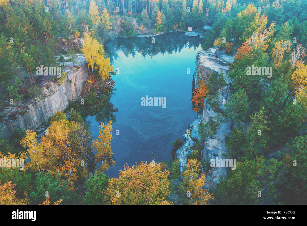 Aerial view of the beautiful lake in the autumn forest. Granite ...