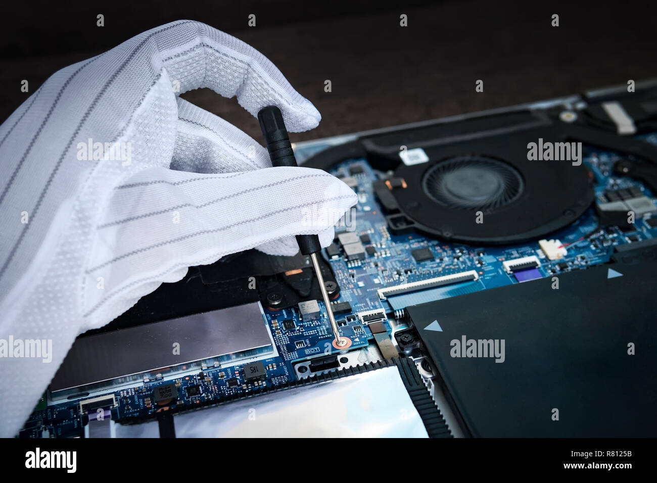 Hands of the technician repairing a computer, Professional laptop ...