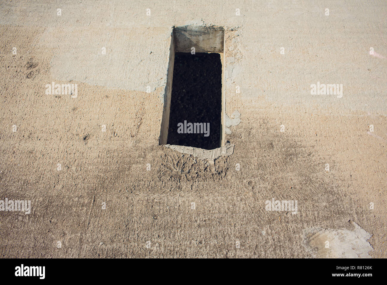 Cement wall with rectangle hole sewerage and electricity wiring Stock ...