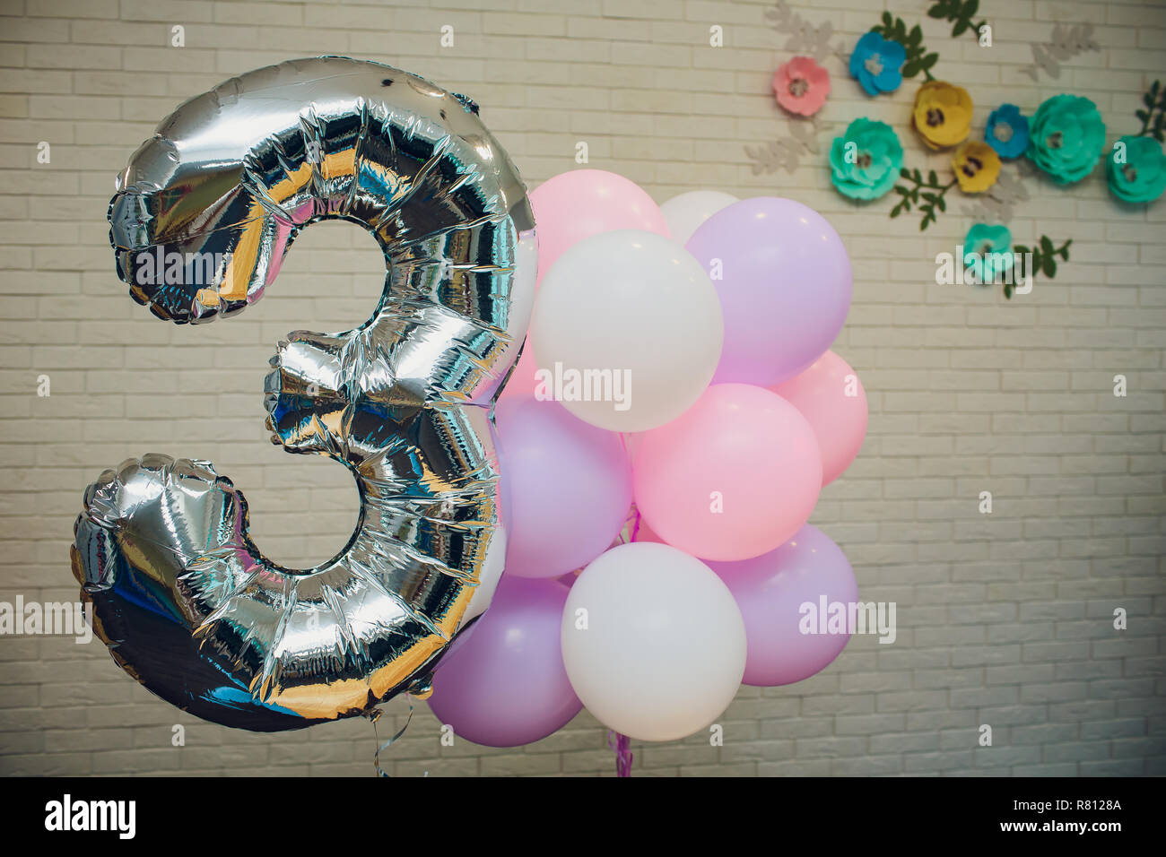 Number three golden balloon photo on the ceiling with other colourful ...