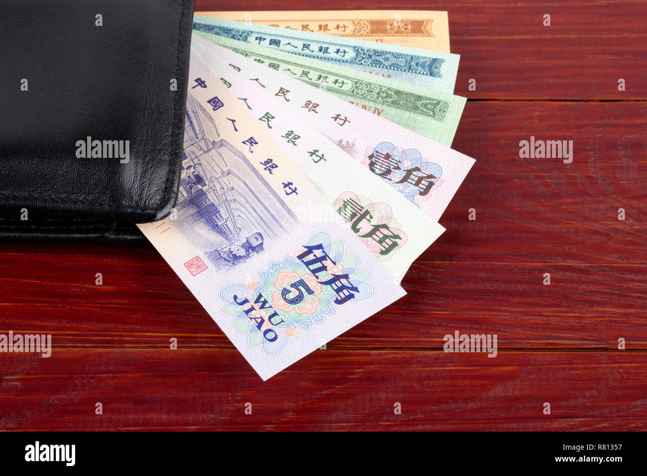 Old Chinese money in the black wallet Stock Photo - Alamy