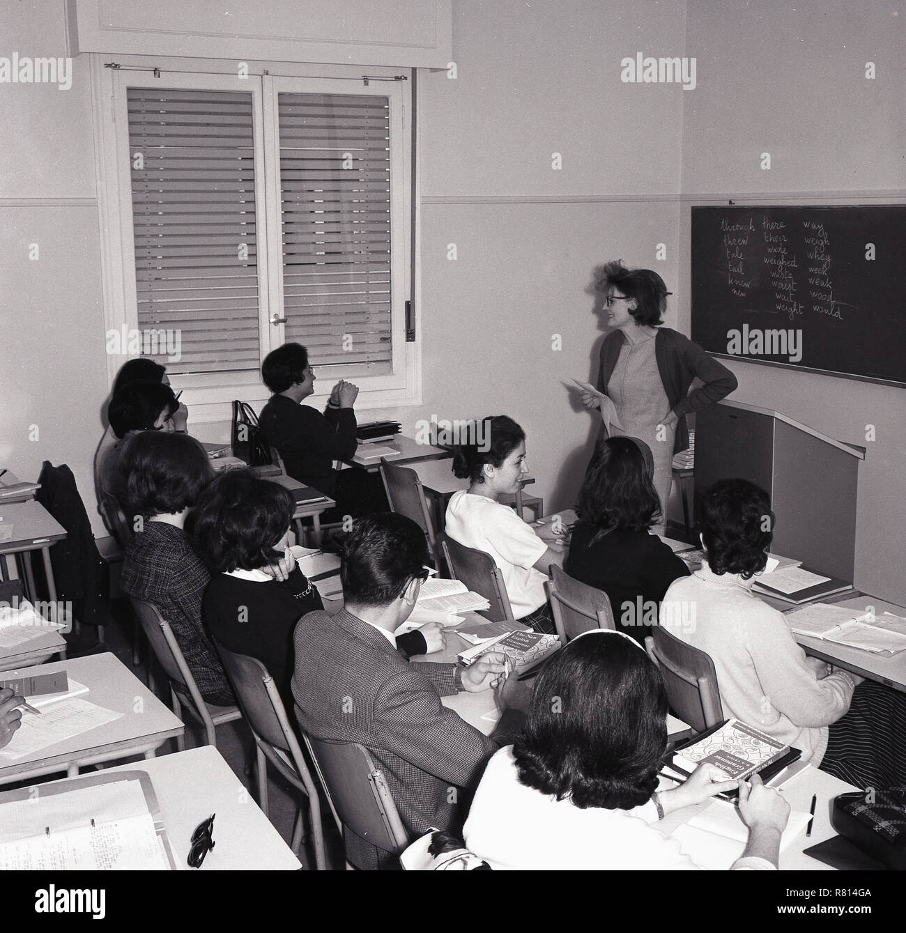 1960s, historical, foreign students inside a classroom having an ...