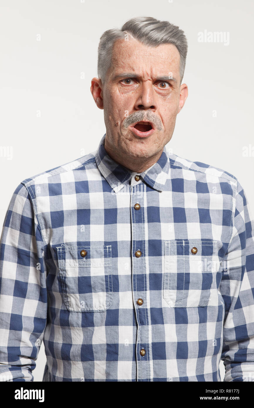 Portrait of angry screaming old man on gray studio background. Human ...