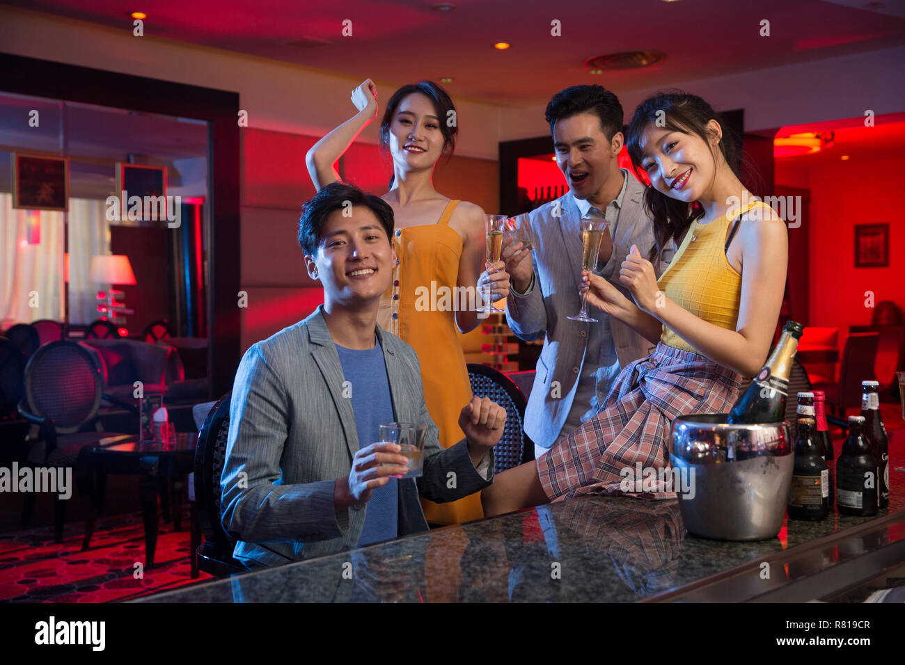 Young people drink in the bar Stock Photo - Alamy