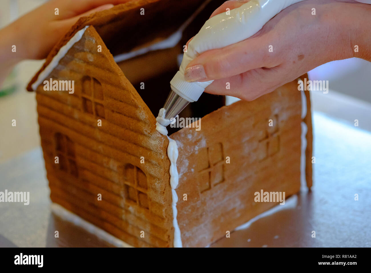Step-by-step photos of the construction of a gingerbread house Stock ...