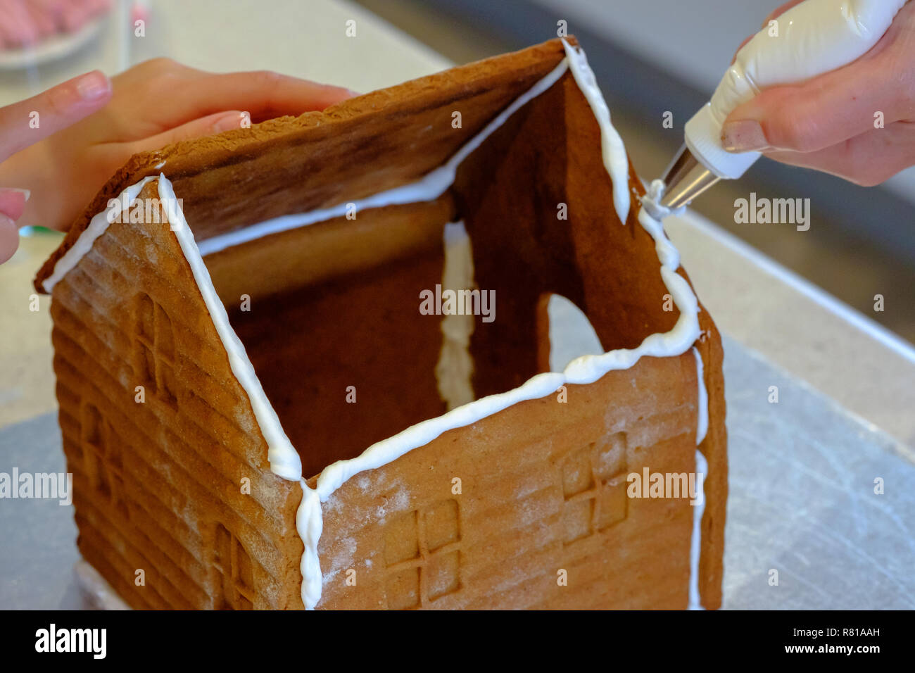 Step-by-step photos of the construction of a gingerbread house Stock ...