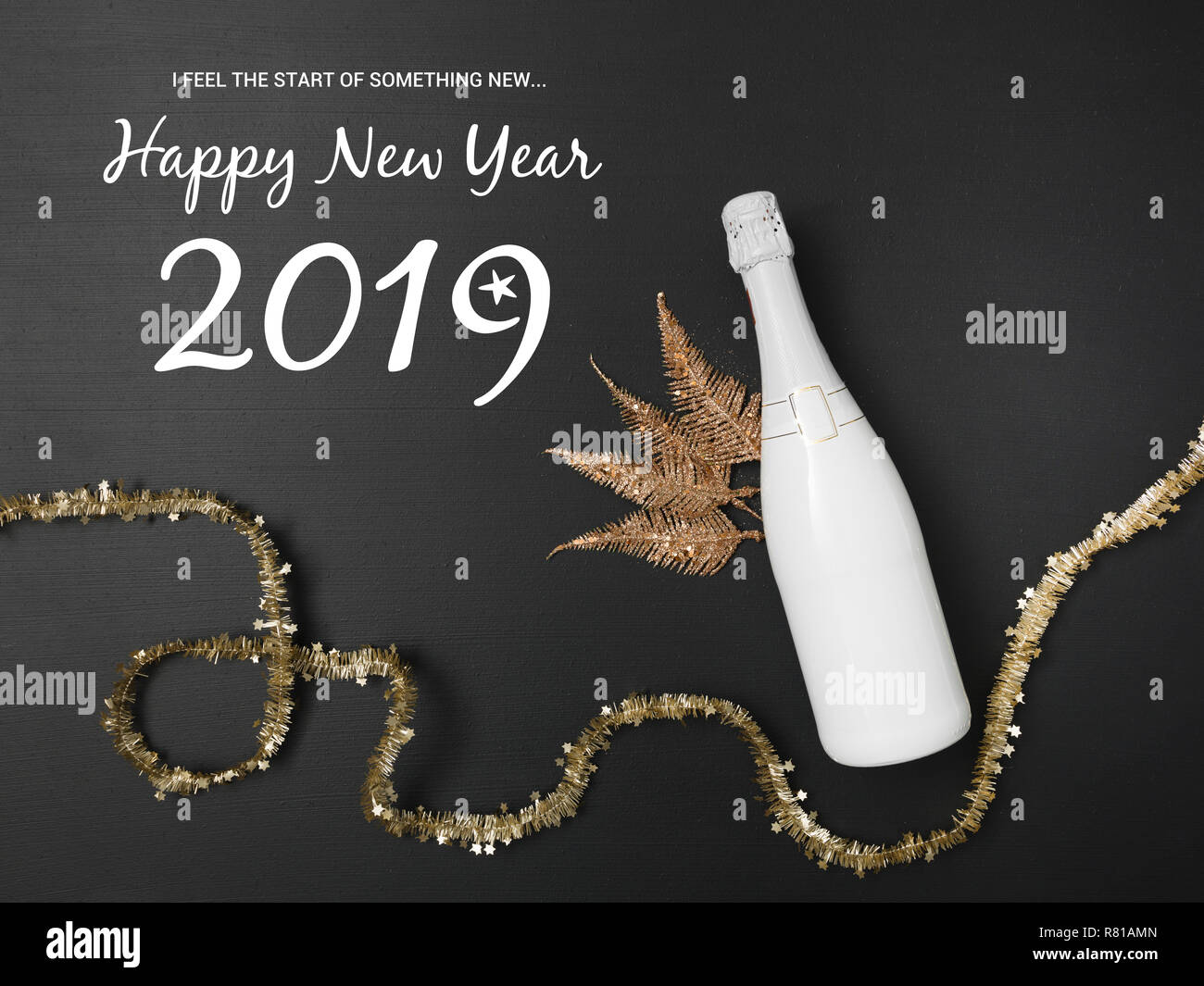 New Year's background with a bottle of champagne on black chalkboard ...