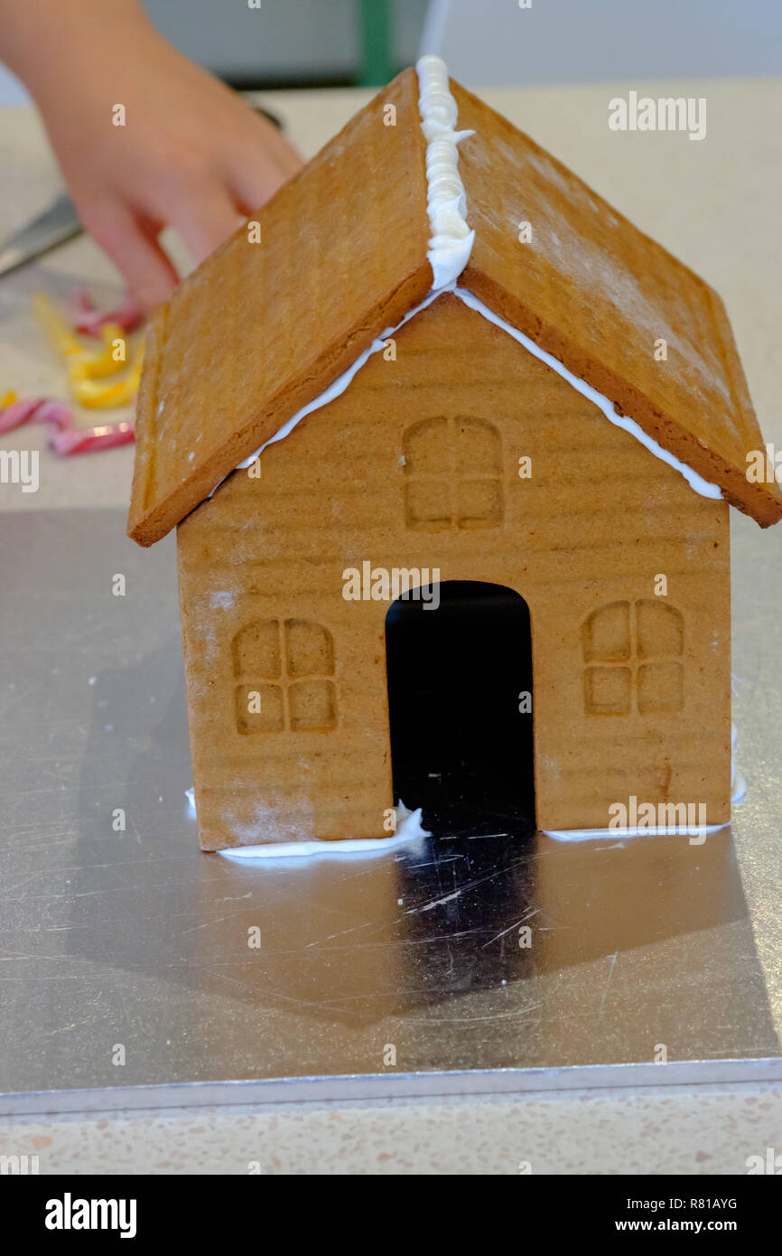 Step-by-step photos of the construction of a gingerbread house Stock ...