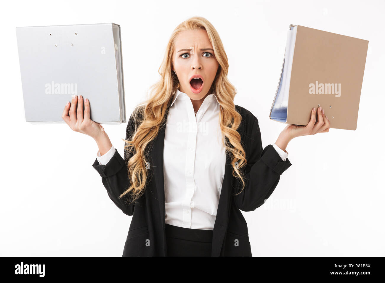 Photo of shocked manager girl wearing office suit holding paper folders ...