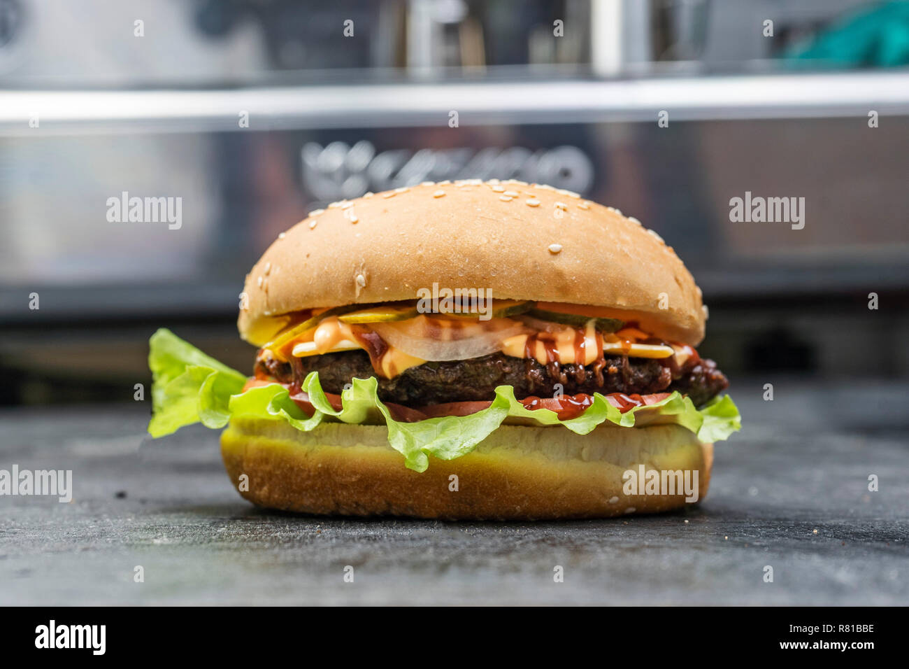 Classic burgers with becon, meat, cheese, onion, tomato and cheese and ...