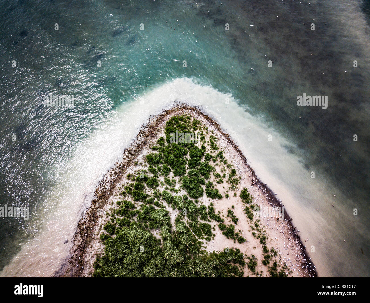 Aerial view of turbulence at the end of a small island in the St ...