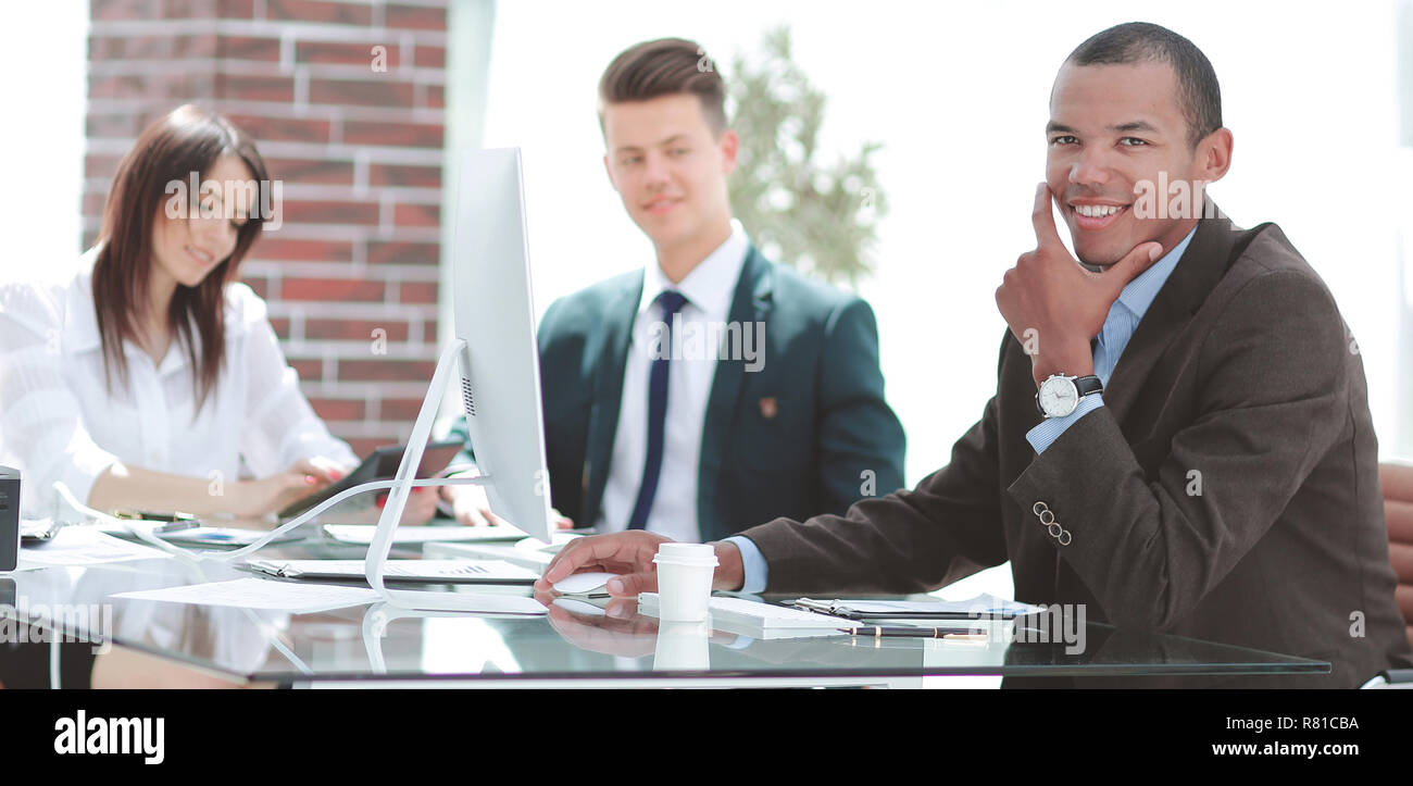 Boss sitting behind desk hi-res stock photography and images - Alamy